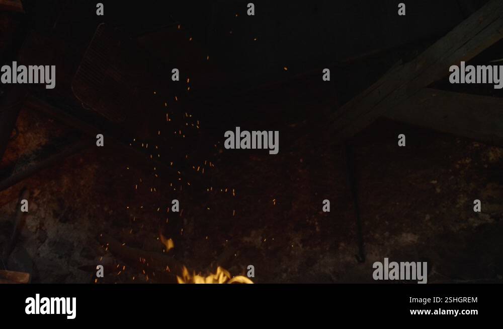 Fire sparks and flame rising in a stone fireplace, slow motion Stock ...
