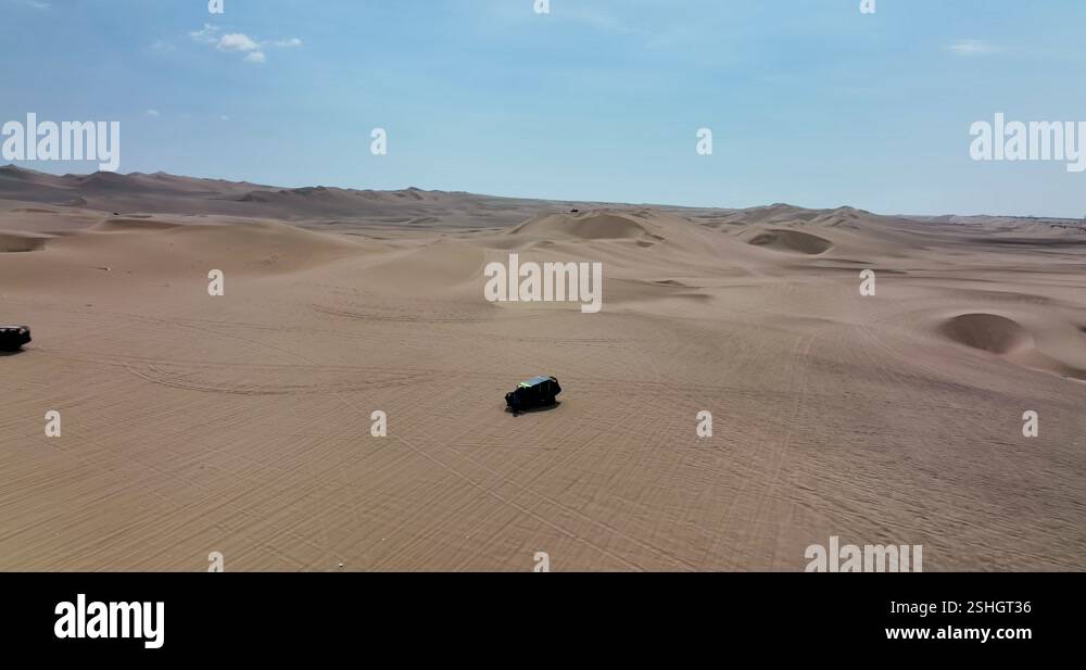 Dune buggies in Huacachina, Peru desert. Fast sand buggy driving on the ...