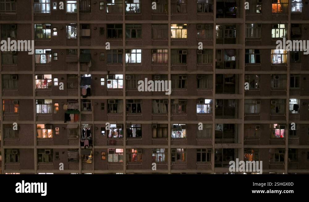 A nighttime view of a crowded high-rise public housing apartment ...