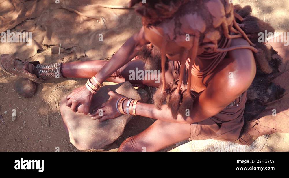 Himba tribe Woman Making Otjize, Cunene Province, Oncocua, Angola Stock ...