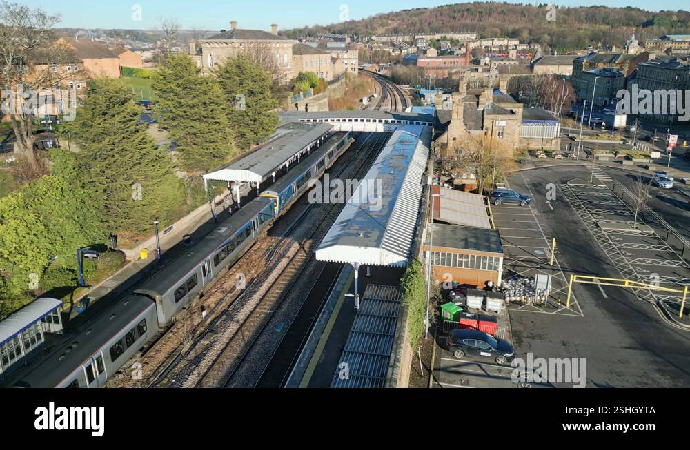 Cinematic aerial drone footage of train parked in train station with ...
