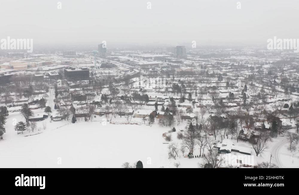 Aerial, rural snow covered suburb community during winter Stock Video ...
