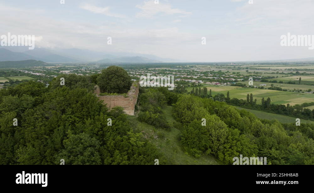 Historical ruins and St. John the Baptist of Alvani basilica on hills ...