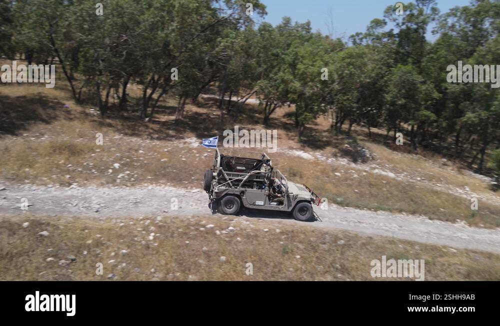 Israel Army infantry squad soldiers on Humvee vehicle driving through ...