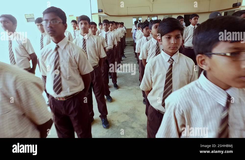 Male students stand in line in uniform for morning assembly Stock Video ...