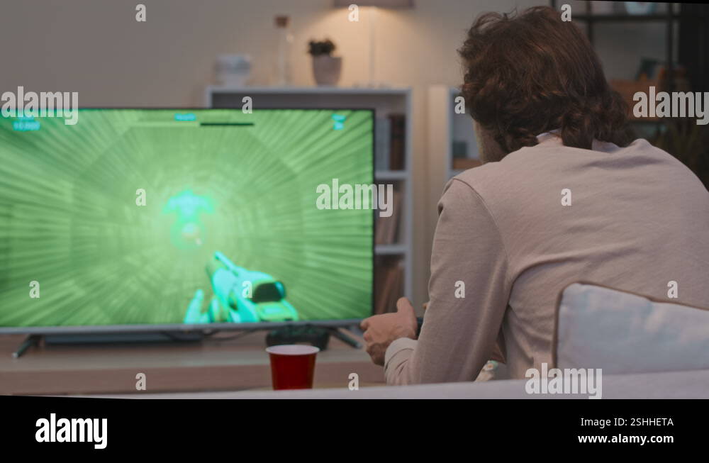 Man Playing FPS Game on Console at Home Stock Video Footage - Alamy