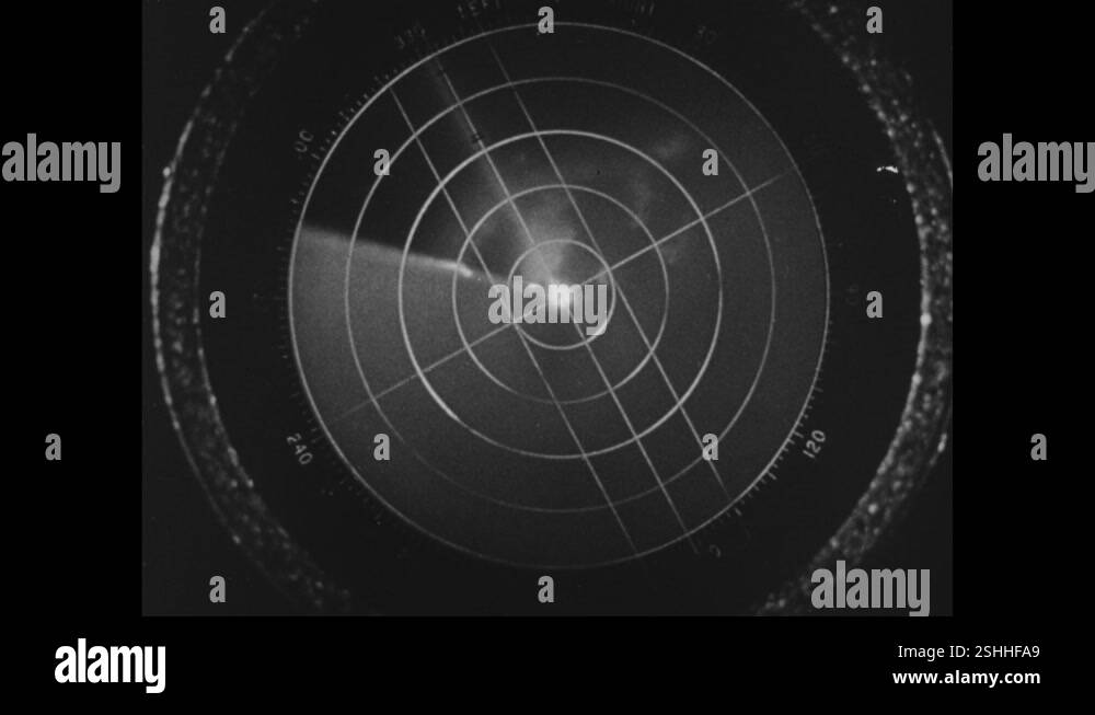 1940s:Radar operator works on airplane. Radar scope detects land. Hand ...