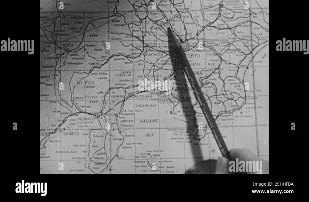 1940s:Pencil points to land on a map. Radar operator works on airplane ...