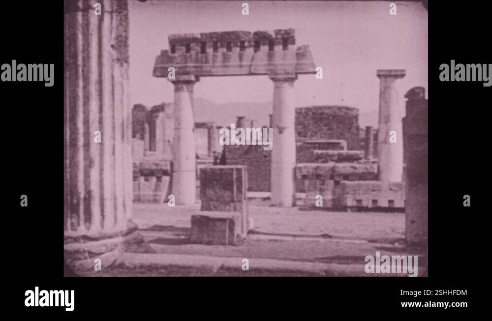 1920s: Text says the Basilica. Building with large columns, stone beams ...