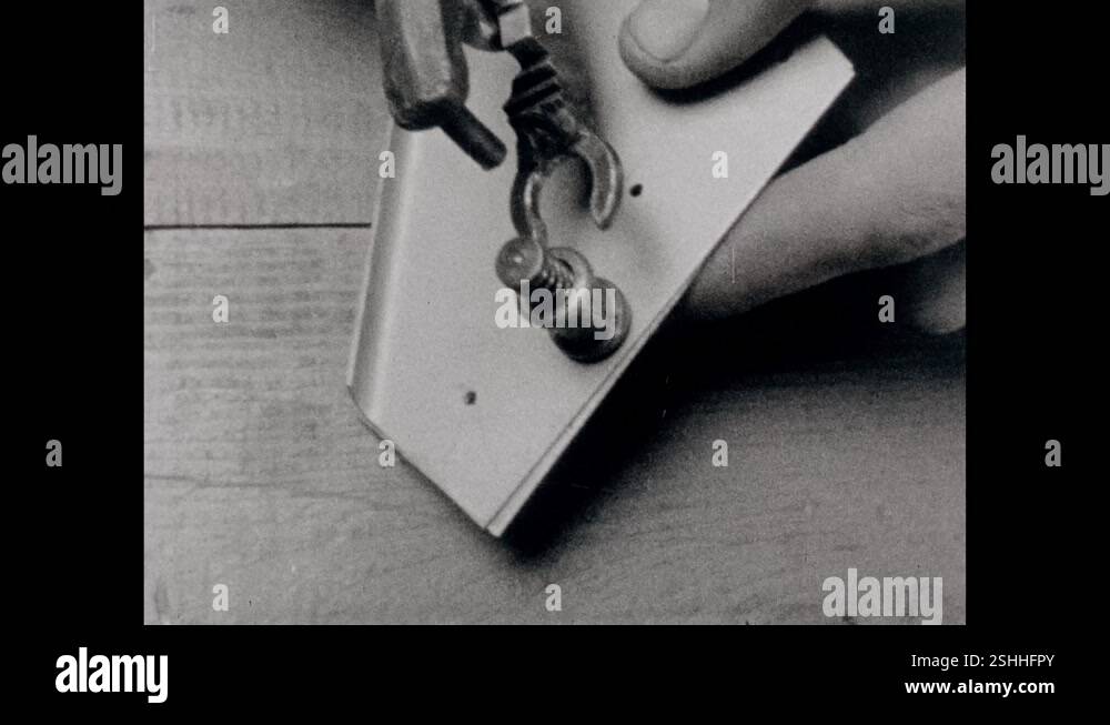 1940s: fastener connecting 2 metal pieces, pliers pull out fastener ...