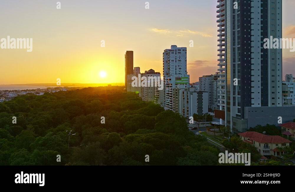 Pedestal up of Punta Sur tower skyscraper with yellow and bright sun in ...
