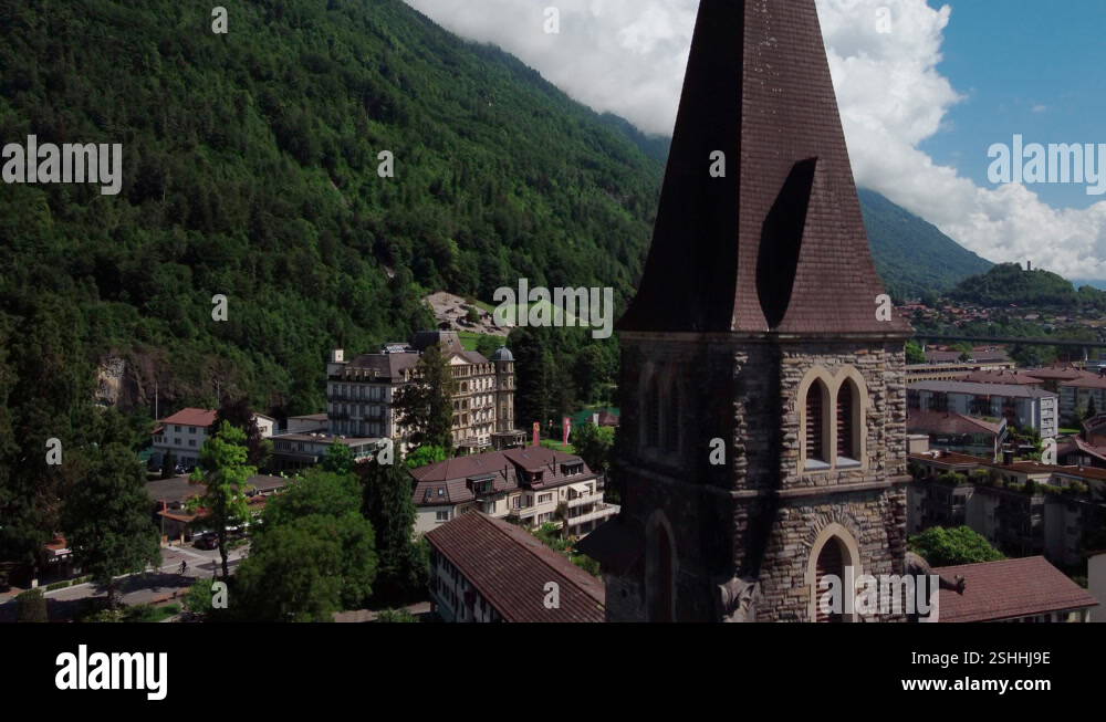 old stone catholic church of Interlaken in the swiss Alps. Aerial view ...
