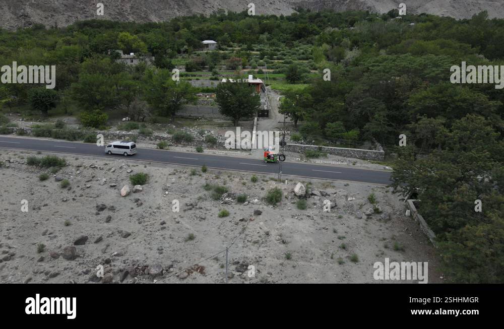 Aerial View of Road Traffic in Hunza Valley, Pakistan. Rickshaw and Van ...