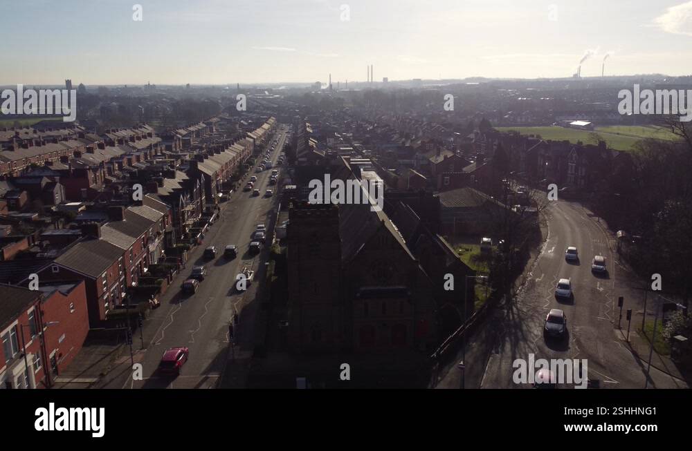 Establishing aerial view over long roads and parish church in terrace ...