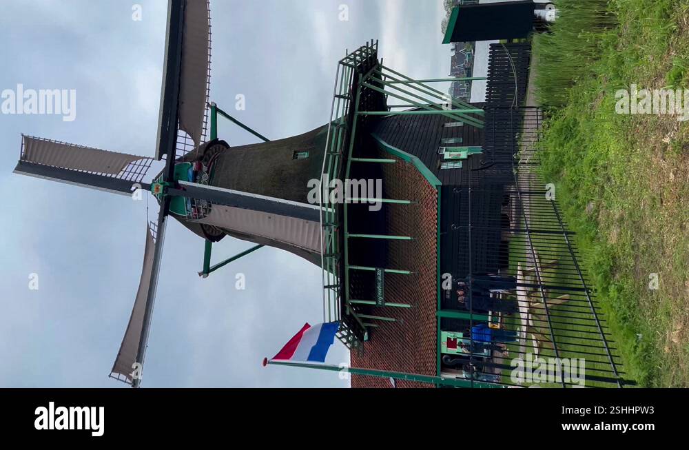 Wooden mills rotating blades river town Zaanse Schans North Holland ...
