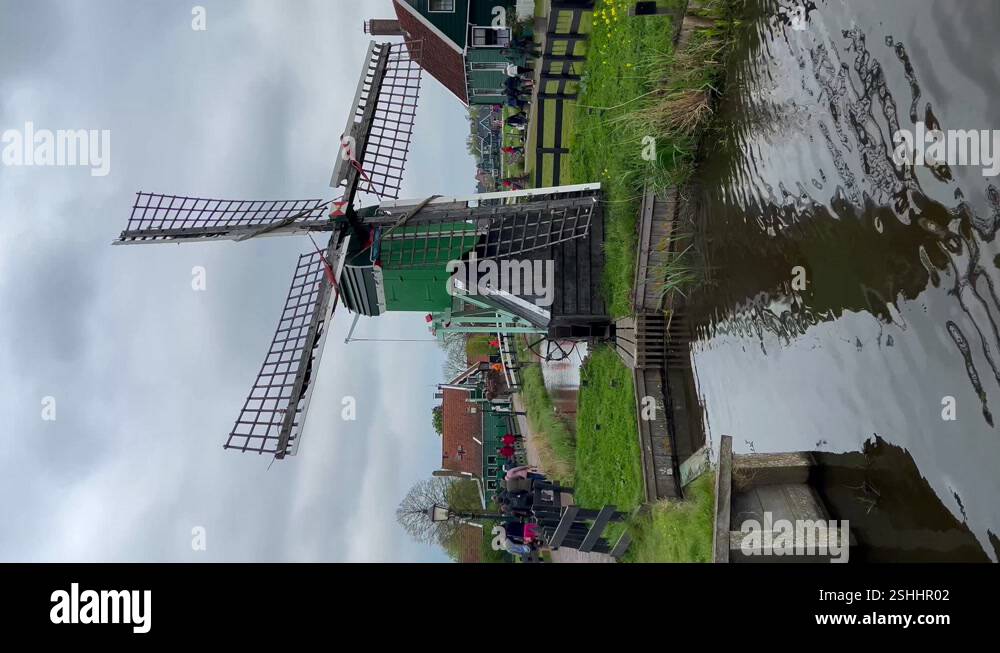 Wooden mills rotating blades river town Zaanse Schans North Holland ...