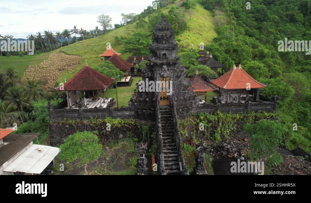 Secluded Hindu temple on Bali greenery Landscape, Aerial Orbiting Shot ...