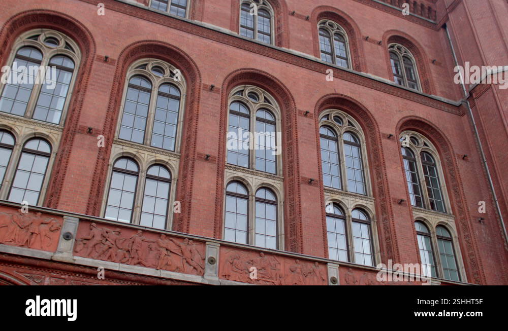 Facade of an old building with high windows. Square glass windows Stock ...