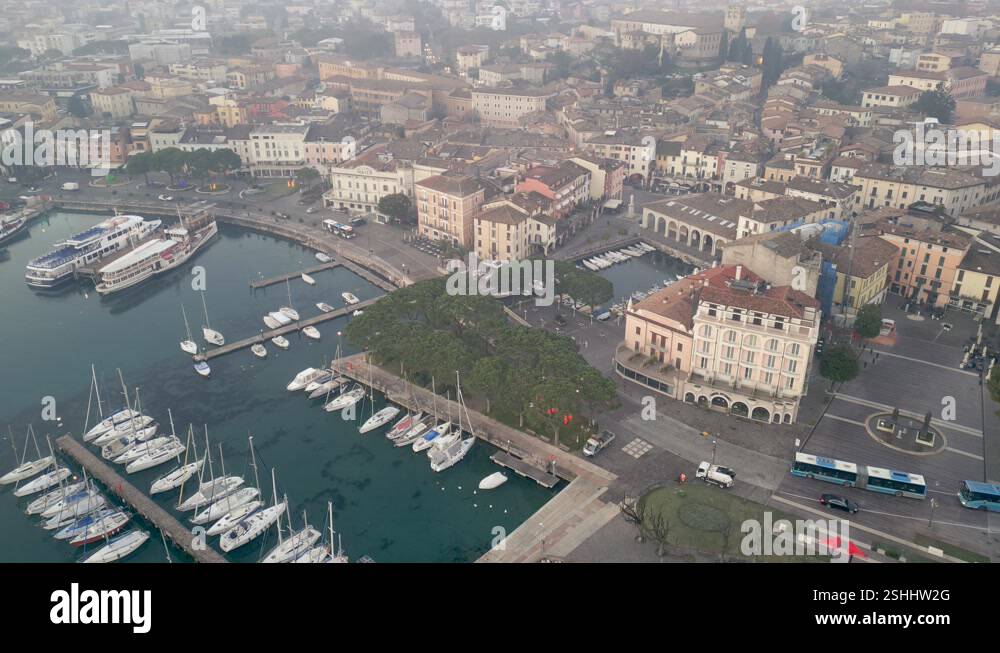 drone flight garda lake near town desenzano del garda in the morning ...