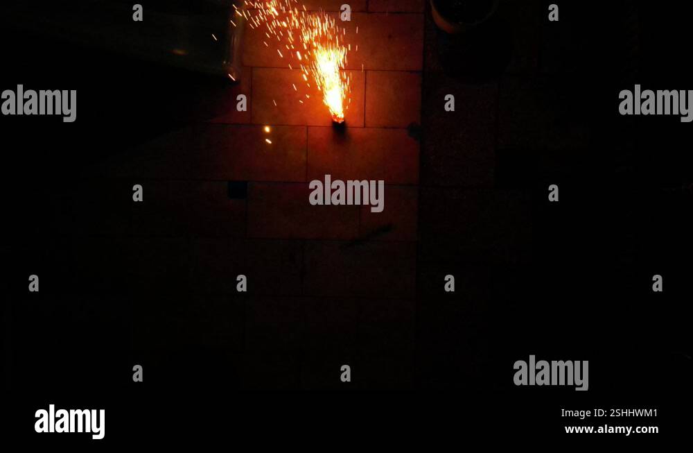 Firecrackers Lighting Up The Wall With Colors And Sparks At Night ...