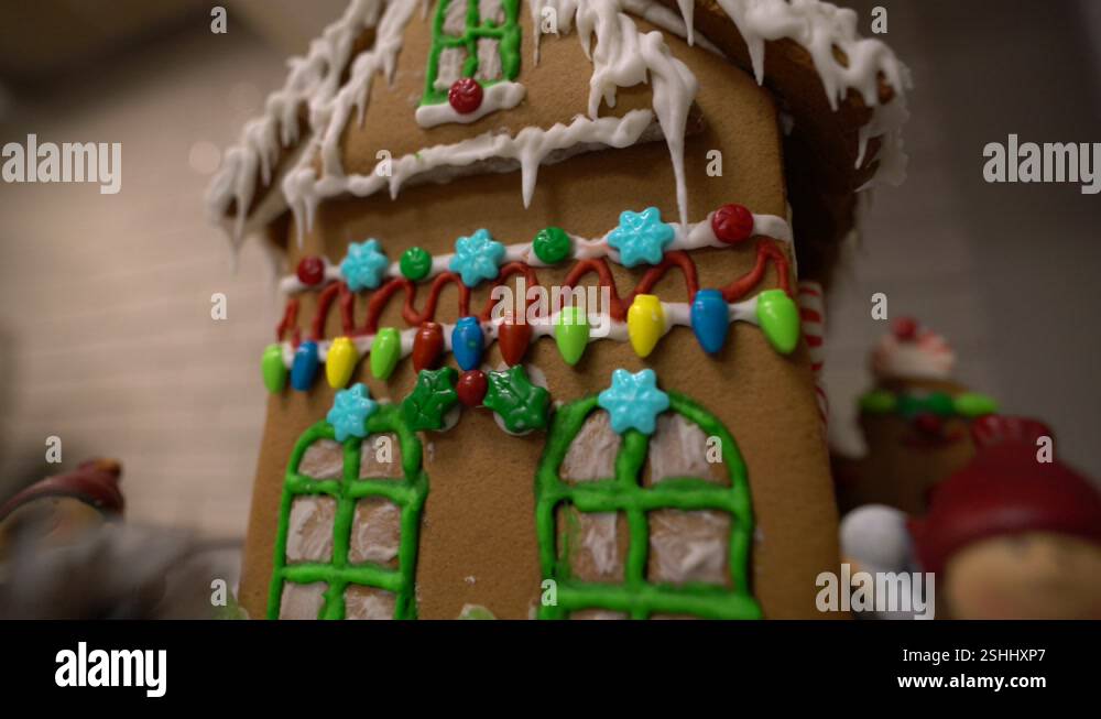 Close up of homemade decorated gingerbread house mansion with icing and ...