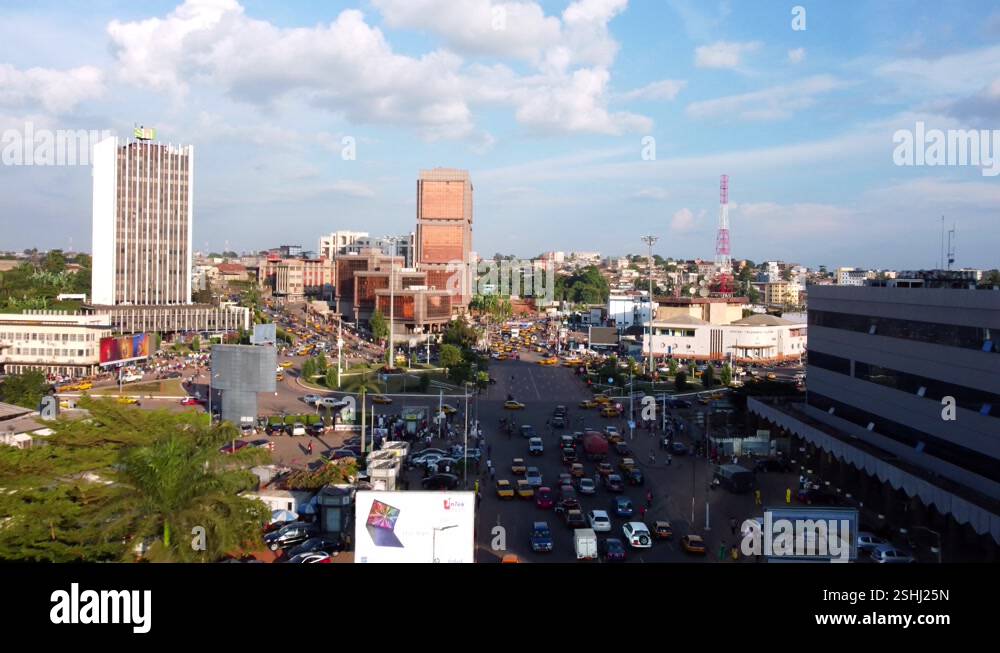 Flying low over streets and traffic in downtown Yaounde, Cameroon ...