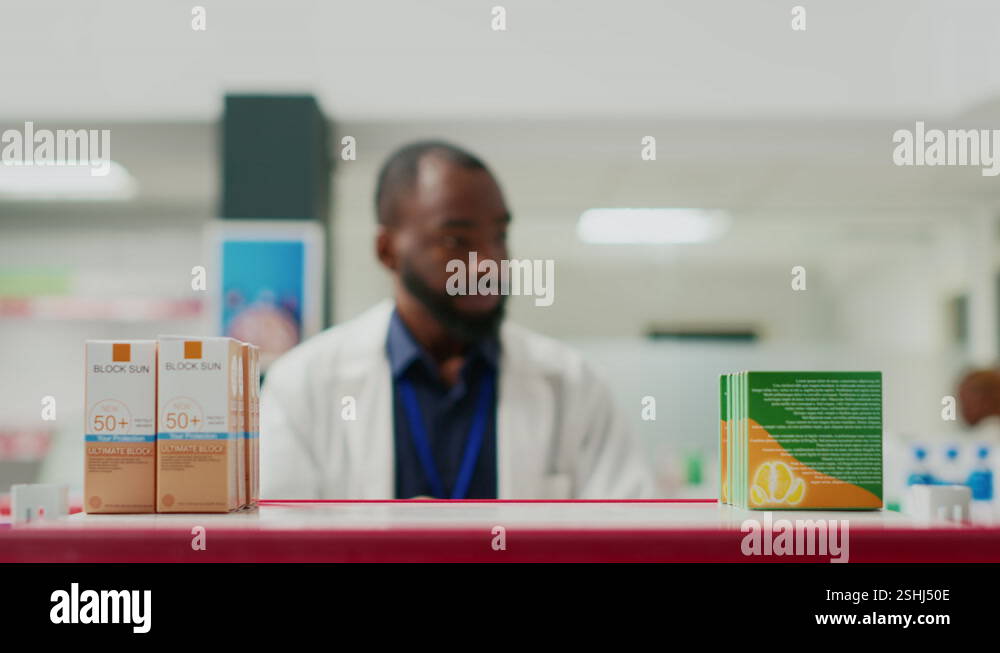 Drugstore consultant organizing drugs on racks Stock Video Footage - Alamy