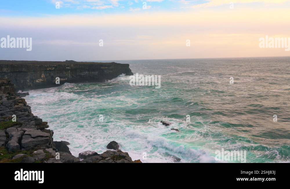 Waves crash up against the coastline on the island of Inis Mór off the ...
