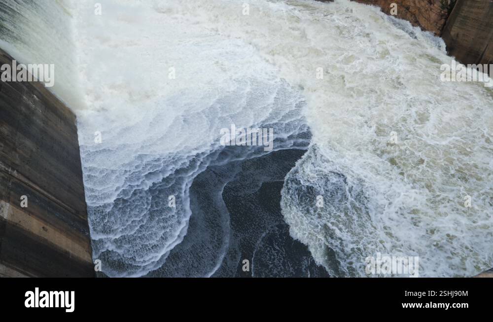 Roiling whitewater rushes down spillway at Hartbeespoort hydro dam ...