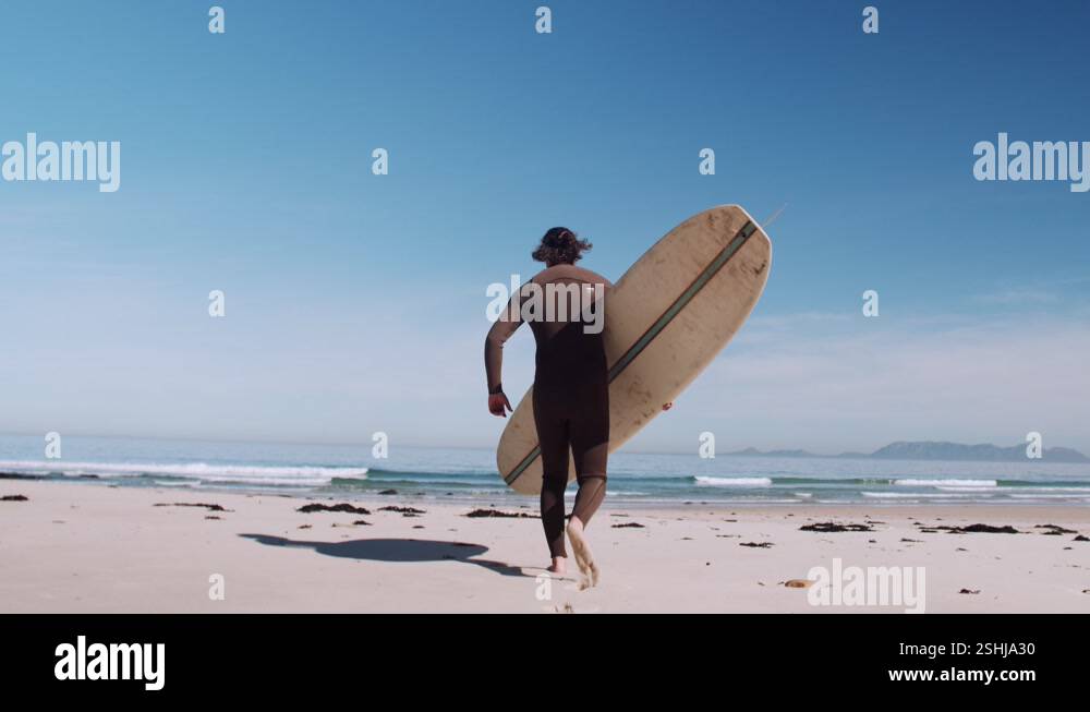 Surfer surfboard under arm Stock Videos & Footage - HD and 4K Video ...