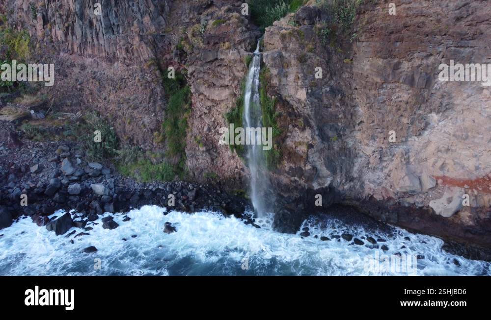 Waterfall Flowing into Ocean on Sea Cliff on Madeira Island, Portugal ...