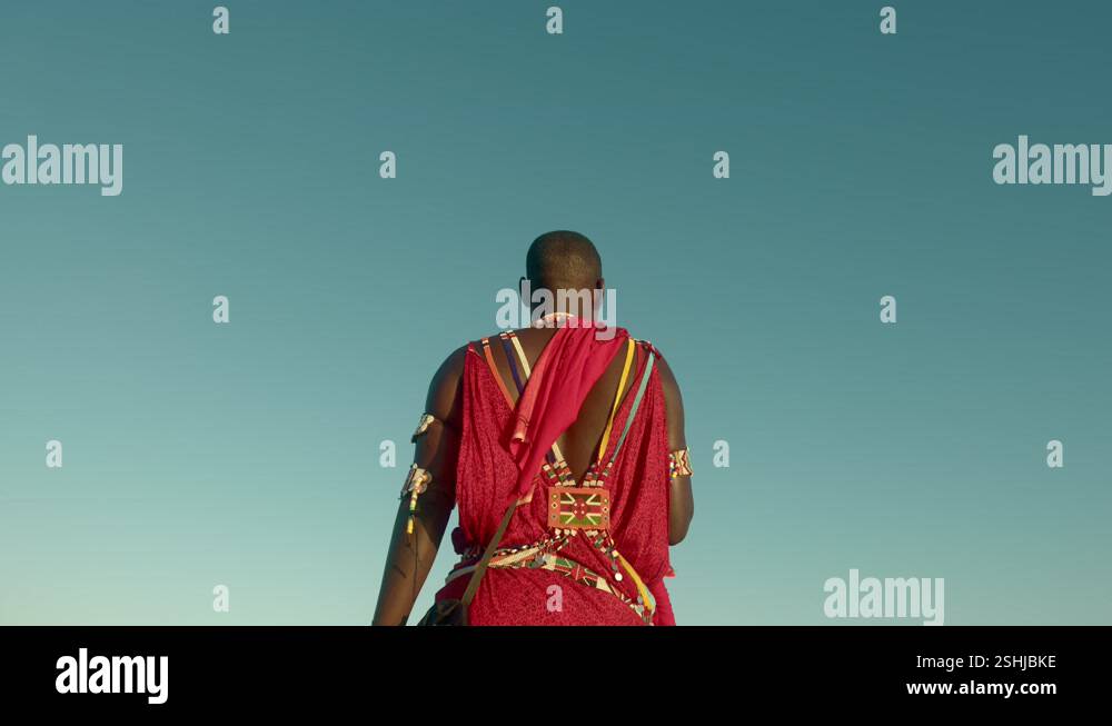 Back View Of An Indigenous Maasai Warrior In Red Traditional Clothes ...