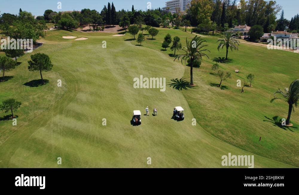 birds eye view of one of the short green lawns of a golf course where ...