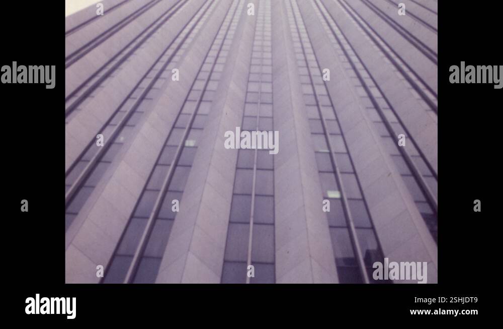 1970s: skyscraper in front rising up off street, construction crew ...