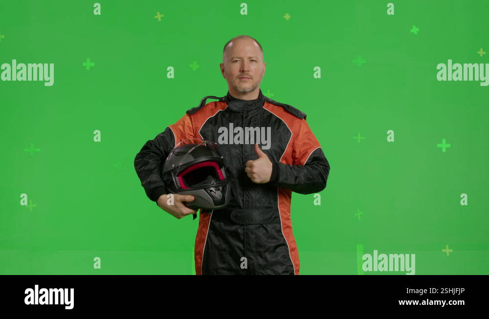racer in a racing suit on green screen background Stock Video Footage ...