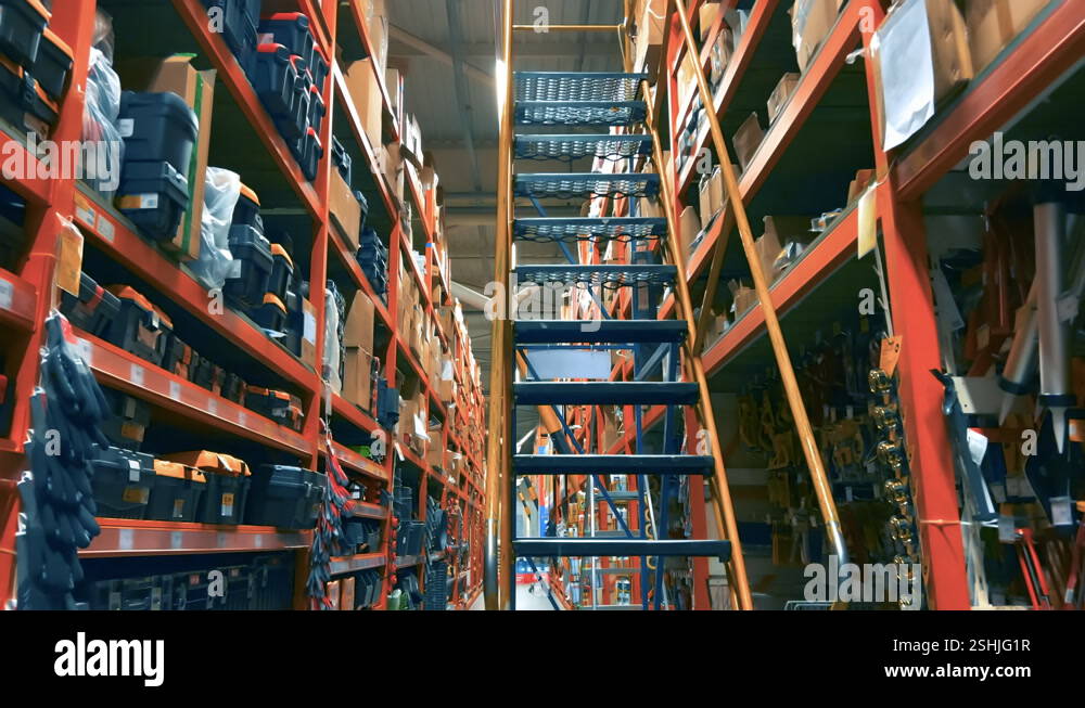 Shelves with goods and tools for home and repair in a warehouse of the ...