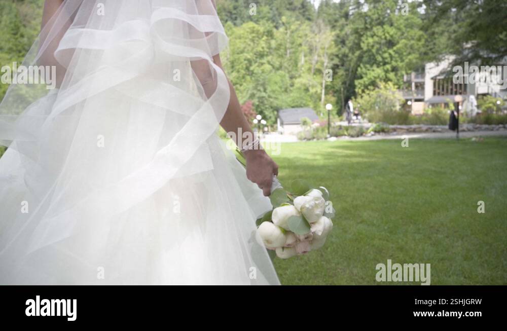 Beautiful bride on way to her wedding. She walks to see her groom Stock ...