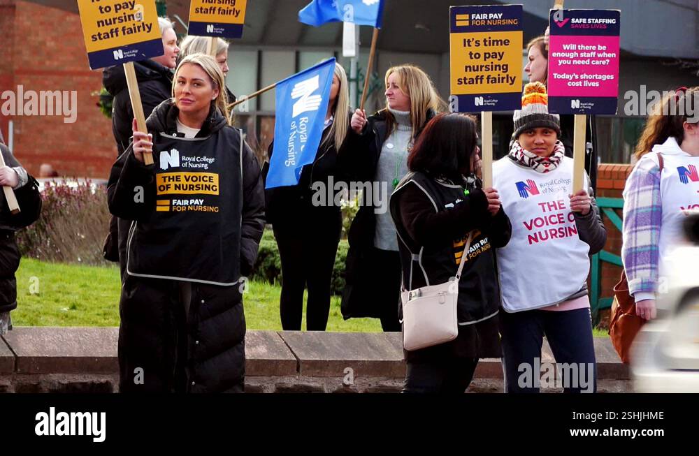 Overworked NHS workers at Whiston hospital in St Helens with banners ...