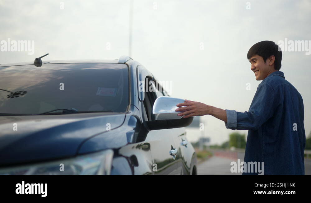 Surprised young handsome man getting the new car. He hugged his a car ...