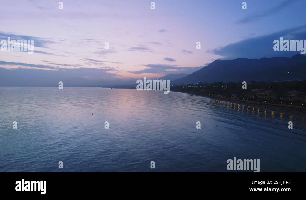 Aerial over the coastline of Marbella after sundown Stock Video Footage ...