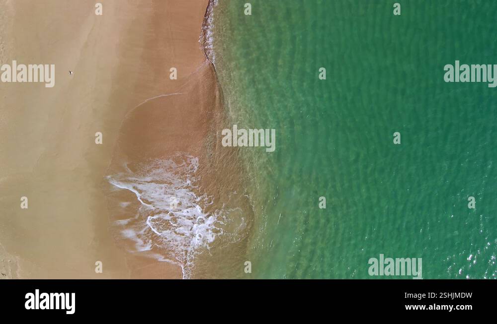 Calming waves rising above the high tide line on the beach Stock Video ...