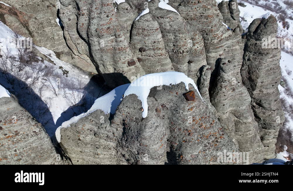 Aerial canyon rock erosion mountain winter snow overhead 4K Stock Video ...