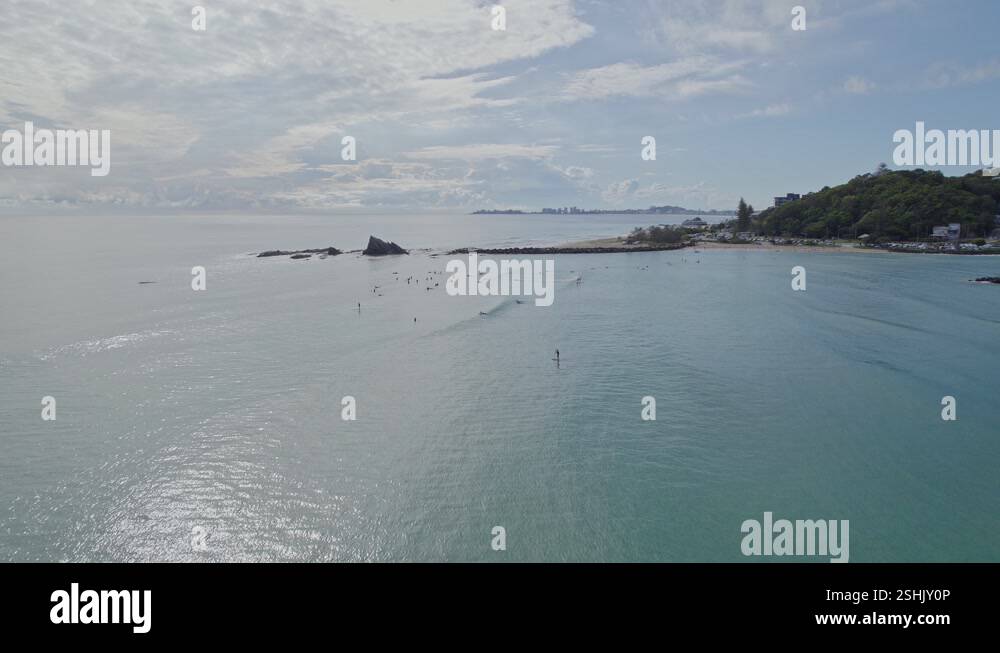 Surfers At The Currumbin Beach With Iconic Rock Formations In Summer ...
