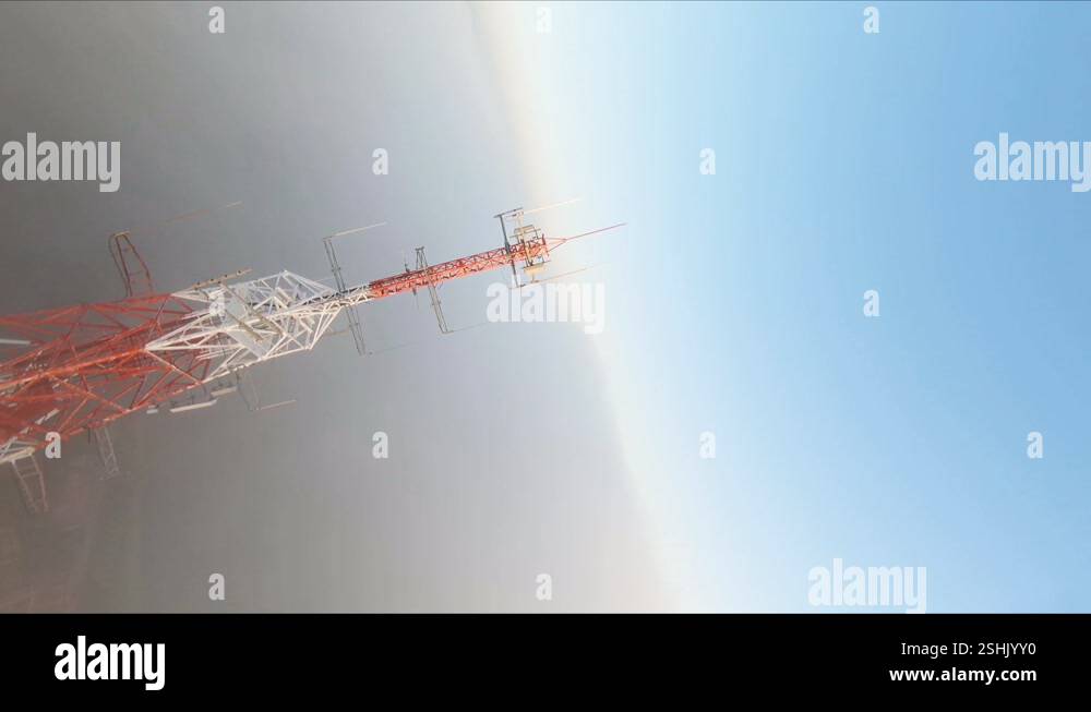 Epic FPV drone flying acrobatics up and down a cell tower on top of a ...