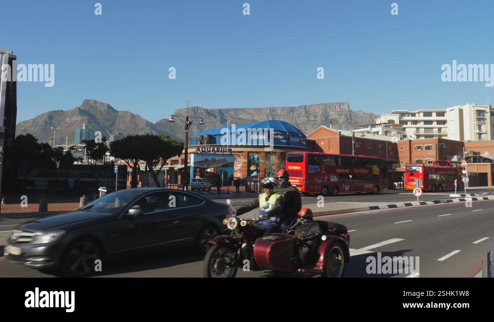 Motorcycle riders with side cars drive past Cape Town Aquarium, RSA ...