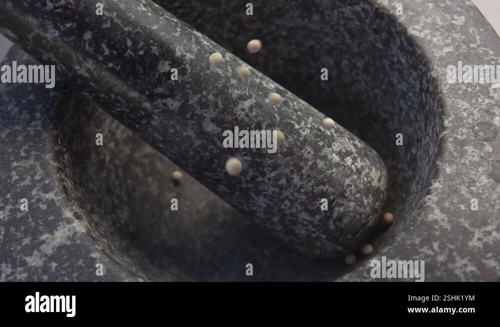 White pepper poured into a mortar Stock Video Footage - Alamy