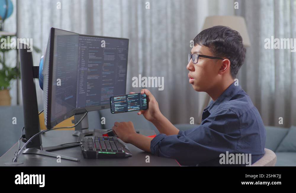 Asian Boy Programmer Using Smartphone While Creating Software Engineer ...