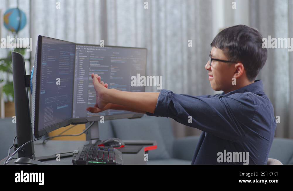 Asian Boy Programmer Stretching While Creating Software Engineer ...
