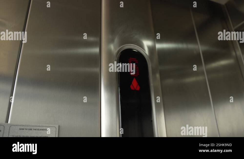 Digital LED display with number and arrows inside elevator with steel ...