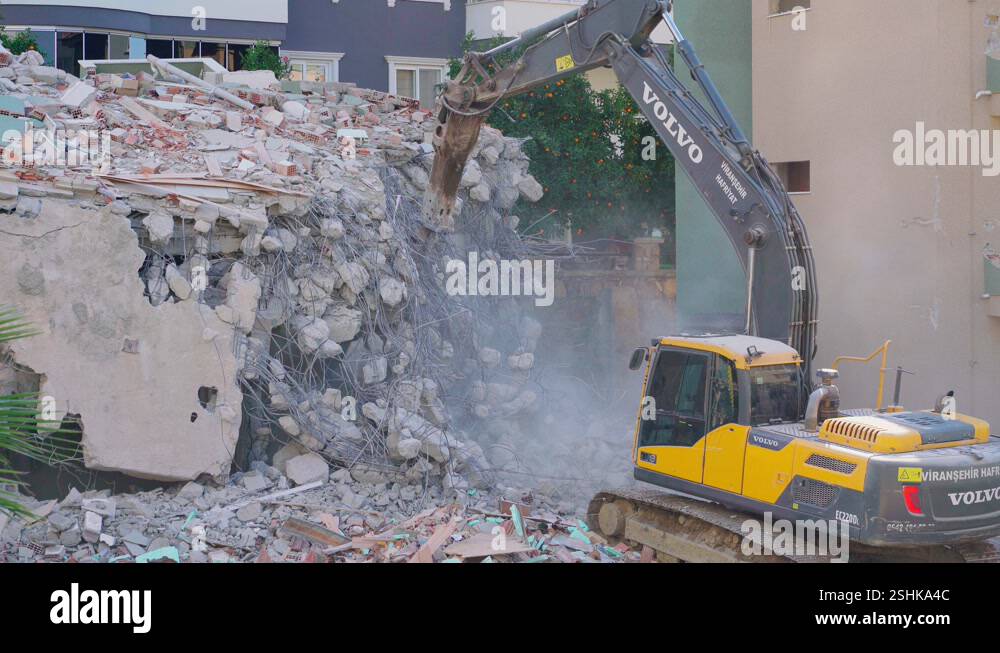 4k, Demolition machine is breaking the floors into pieces and throwing ...